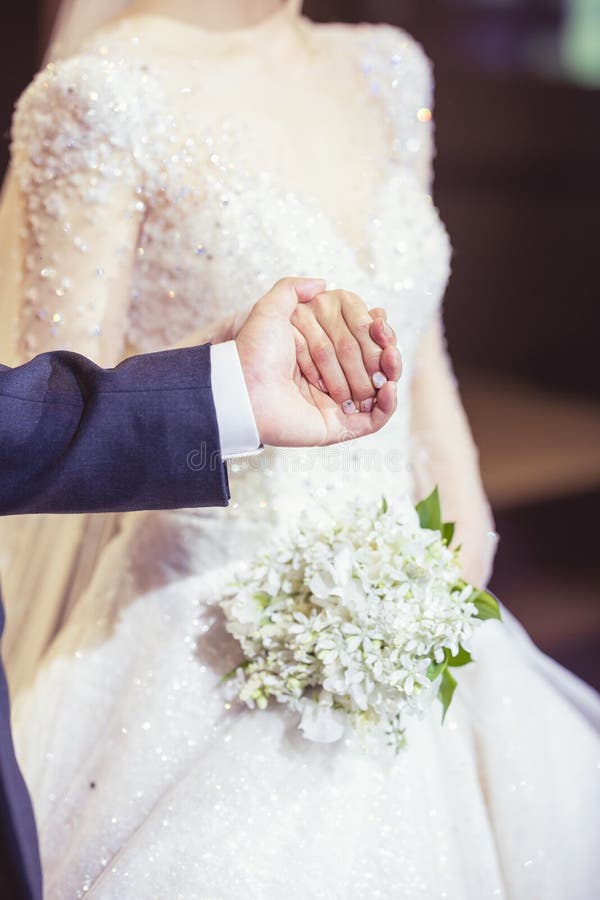 Newly Wed Couple Holding Hands Stock Photo - Image of closeup, isolated ...