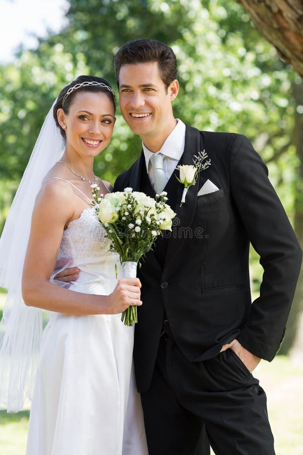 Newly Wed Couple Looking Away in Park Stock Image - Image of three ...