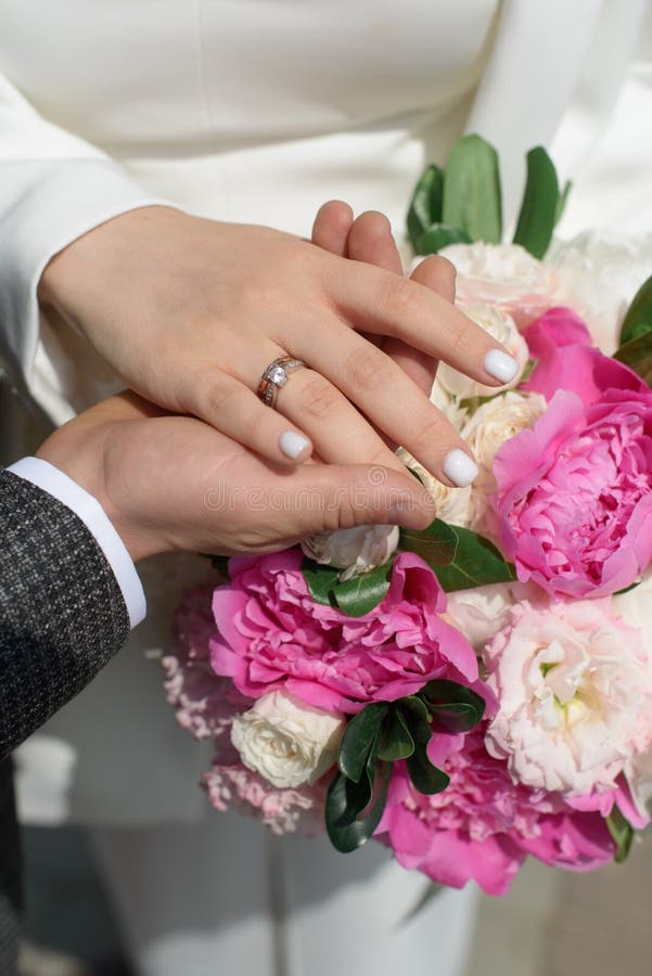 Newly Wed Couple& X27;s Hands with Wedding Rings Stock Photo - Image of ...