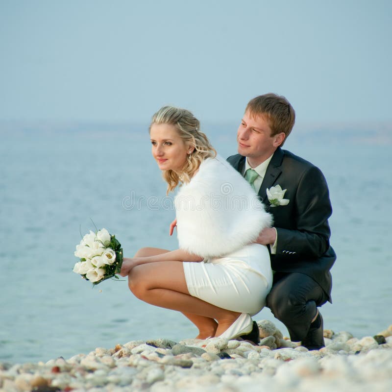 Newly wedded on seashore stock photo. Image of twenties - 21767544