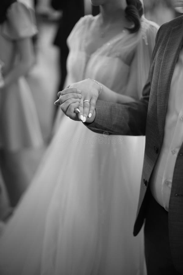 Newlyweds in Formal Attire Walk Hand in Hand Down the Aisle. Stock ...