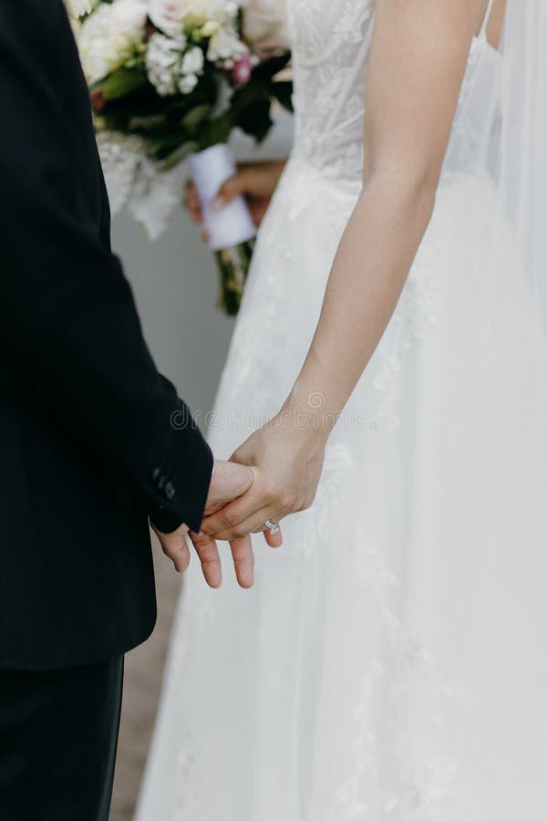 Newlyweds Hold Hands at Wedding Reception Stock Photo - Image of ...