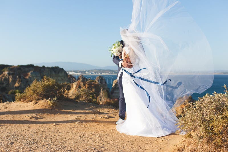 Newlyweds Kissing on the Beautiful Cliff Against the Backdrop of the ...