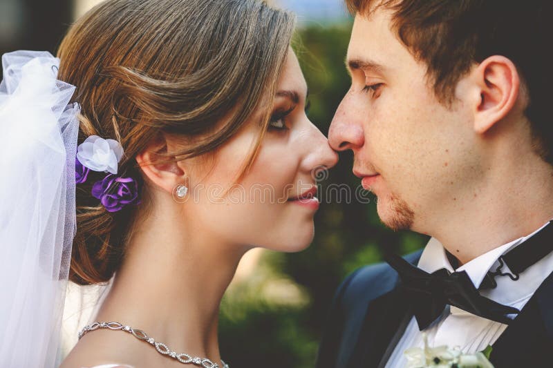 Newlyweds Smile Standing on a Kiss Place Stock Photo - Image of ...