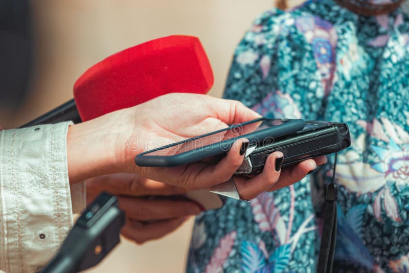 News Reporters Interviewing an Unrecognizable People Outdoors Stock ...