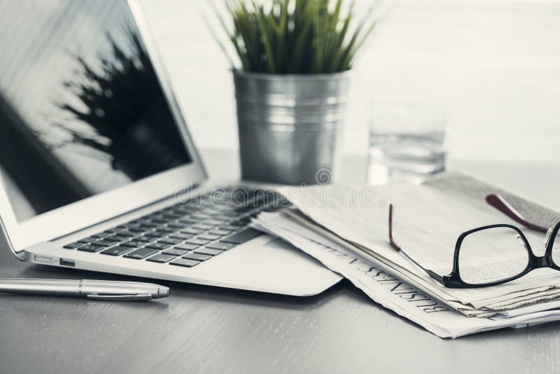 Newspaper with Computer on Table Stock Photo - Image of table, read ...