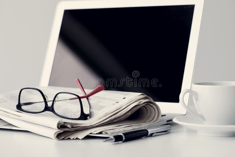 Newspaper with Computer on Table Stock Image - Image of glasses, press ...