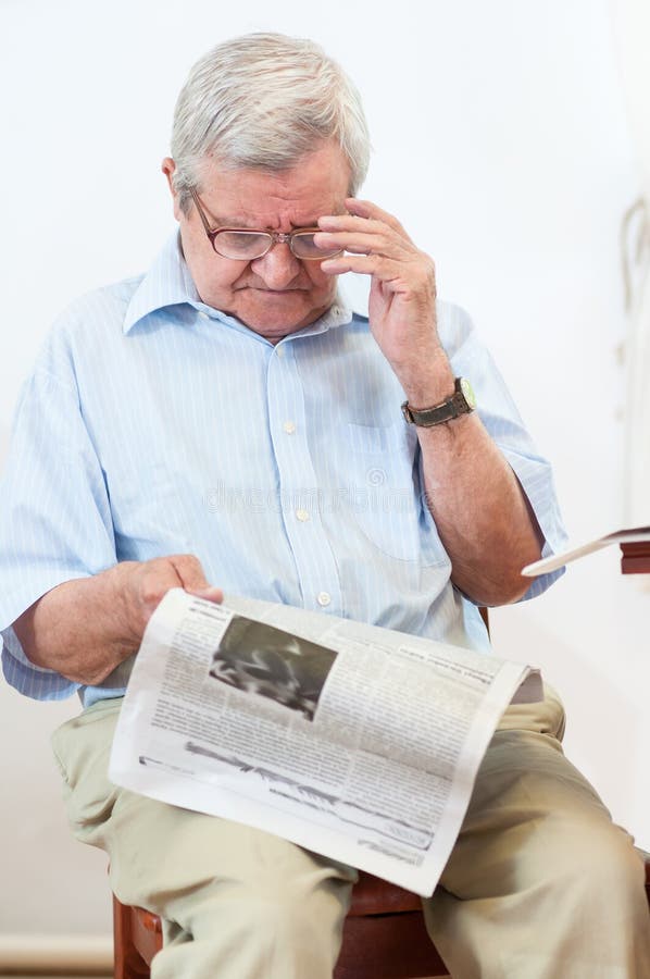 Sad Man Reading Newspaper Stock Photos - Free & Royalty-Free Stock ...