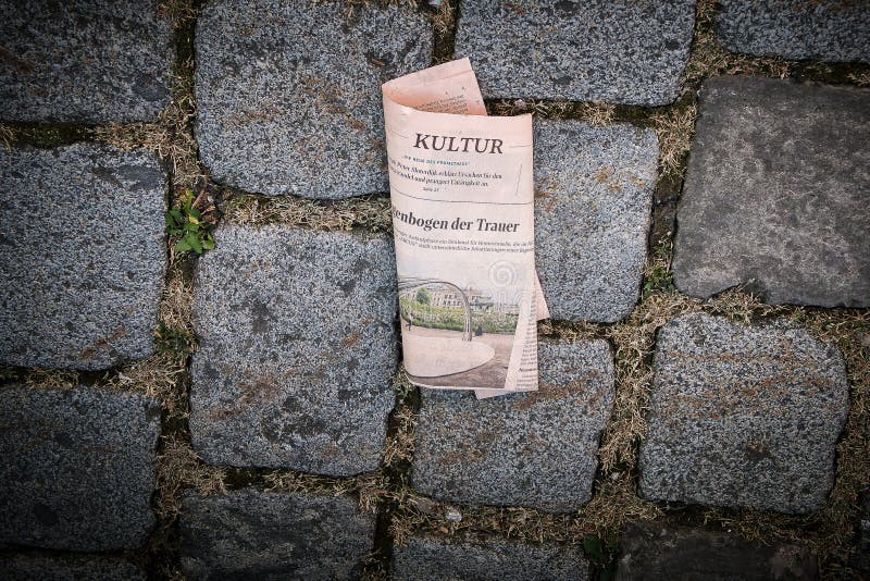 Newspaper Discarded on Rocky Ground Editorial Image - Image of urban ...