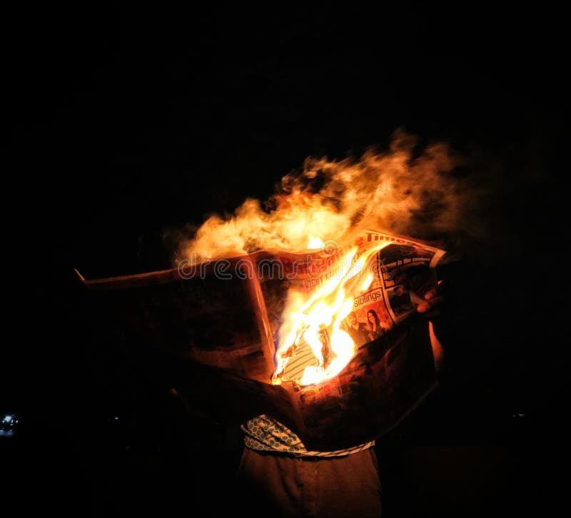 Newspaper on fire editorial photography. Image of called - 129676847