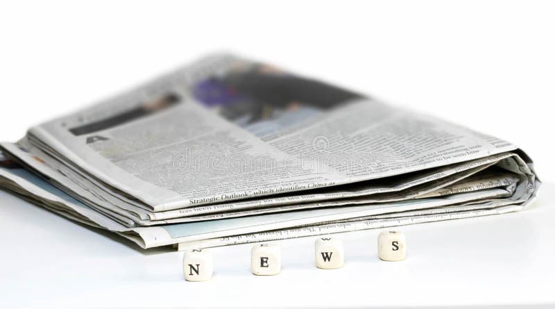 Newspaper Folded with Wooden Abc Text on White Background Stock Photo ...