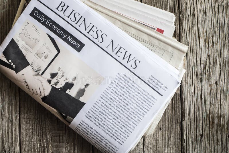 Newspaper on wooden table stock photo. Image of view - 87653702