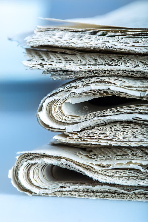 Newspapers Folded and Stacked on the Table Stock Photo - Image of ...