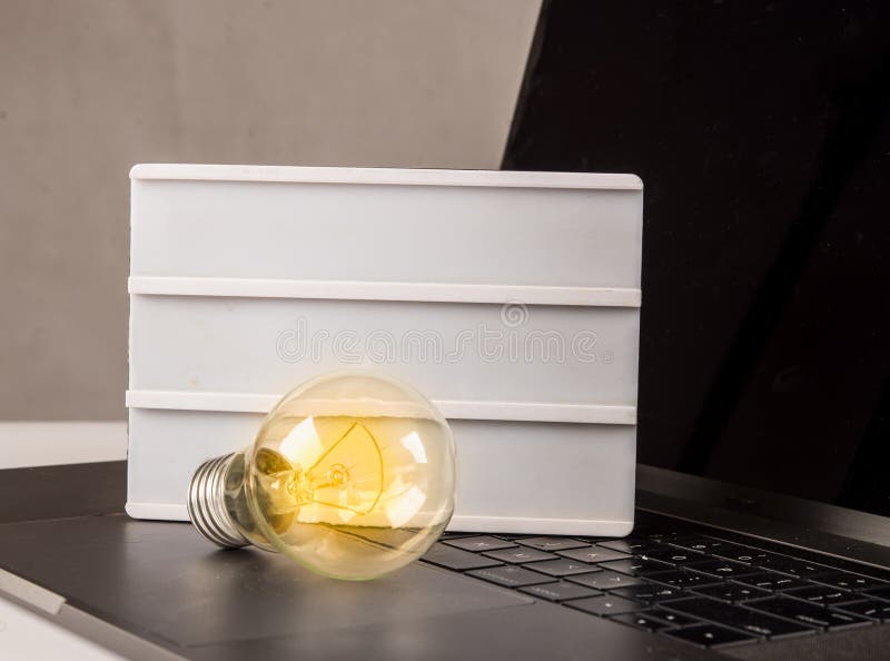 Next Big Idea Concept with Light Bulb on Laptop Touch Pad Stock Photo ...