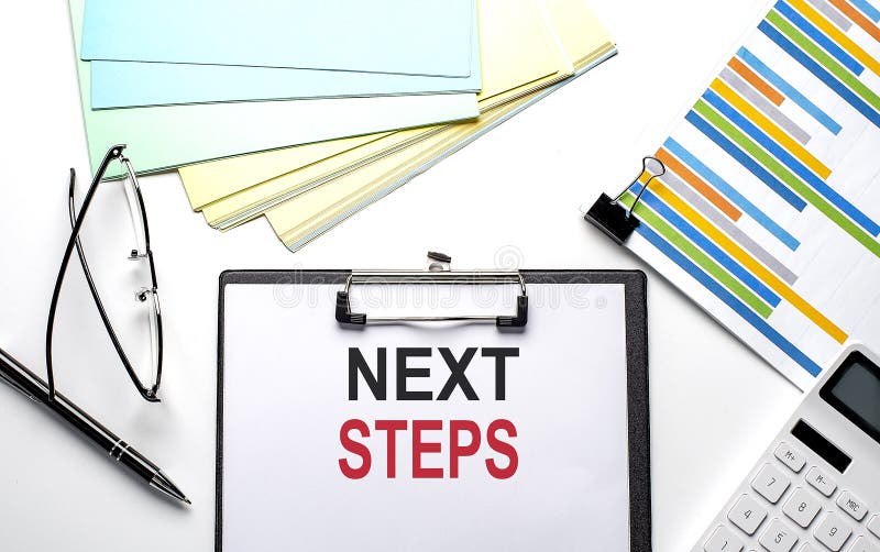 NEXT STEPS Text on Paper Sheet with Chart,color Paper and Calculator ...