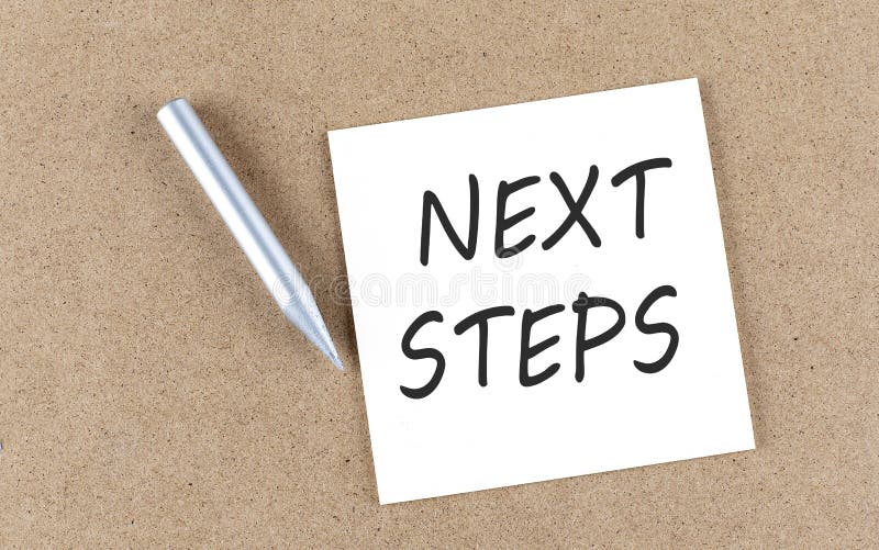 NEXT STEPS Text on Sticky Note on Cork Board with Pencil Stock Image ...