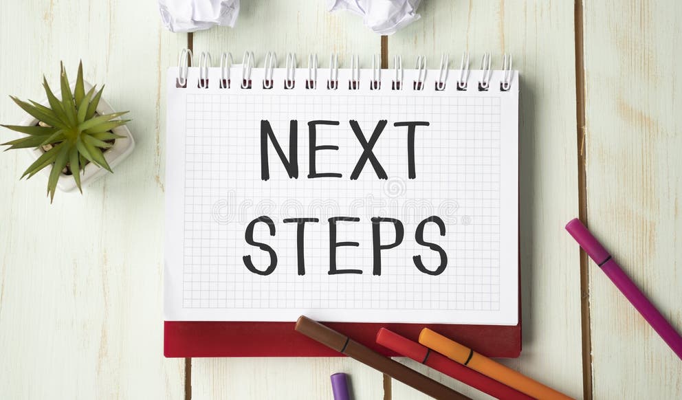 NEXT STEPS Text on Wooden Desk with Tablet Pc Stock Image - Image of ...