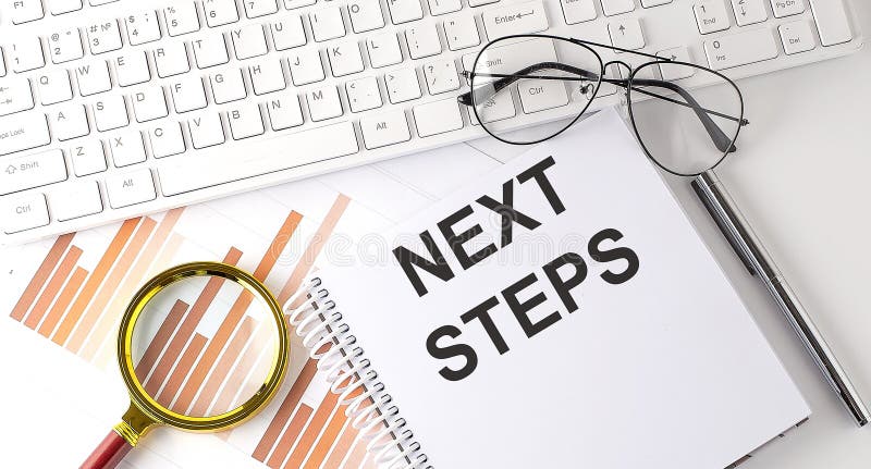 NEXT STEPS Text Written on Notebook with Keyboard, Chart,and Glasses ...