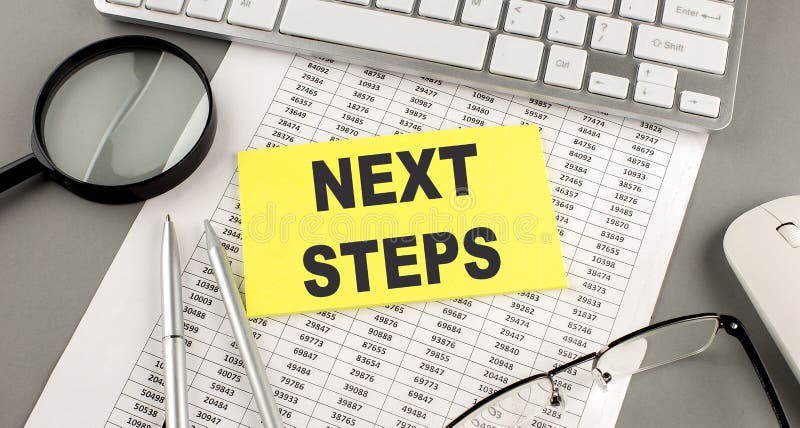 NEXT STEPS Text Written on a Sticky on Chart with Keyboard and ...