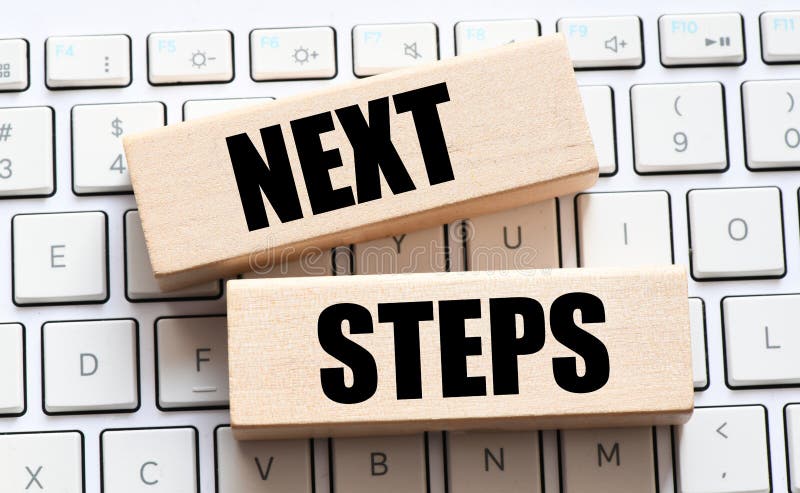 NEXT STEPS Words on Wooden Blocks Placed on a Computer Keyboard Stock ...
