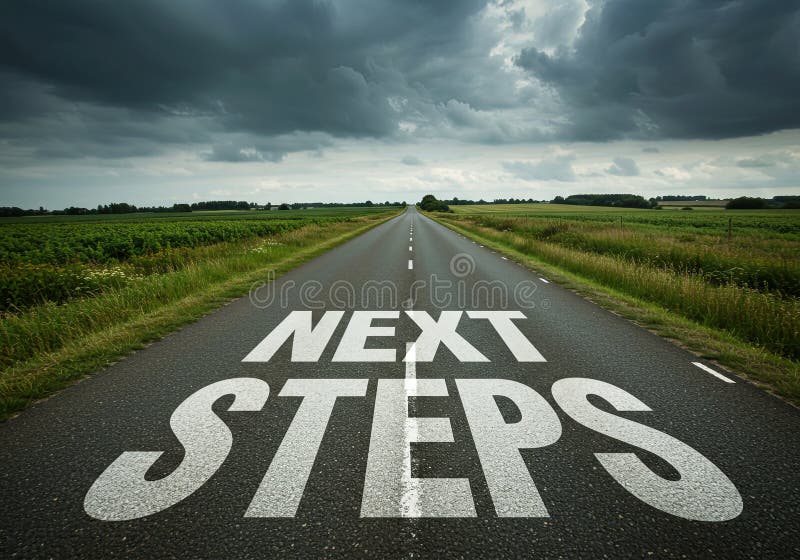 Asphalt Road with NEXT STEPS Painted Under Dramatic Sunset Sky Stock ...