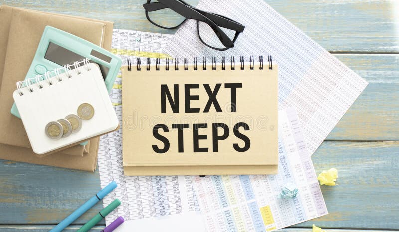 NEXT STEPS Text on Wooden Desk with Tablet Pc Stock Image - Image of ...