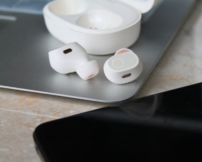 Modern White Wireless Earbuds, with a Ring Indicator Light that S ...