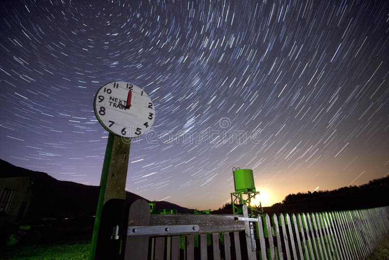 Next train clock at night stock image. Image of abstract - 21790215