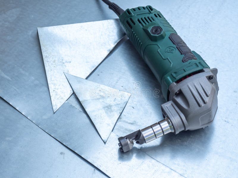 Nibbler on a Sheet of Galvanized Tin Stock Image - Image of sheet ...