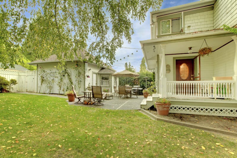 Nice Back Yard with Cozy Patio Area and Shed Stock Image - Image of ...
