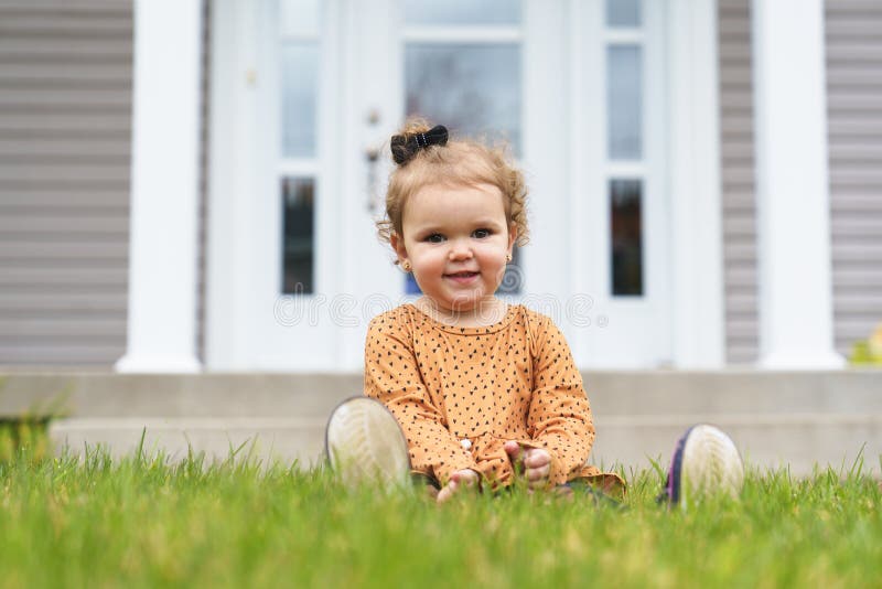 Nice and Beautiful Child Sit in Front of the Family House Stock Photo ...
