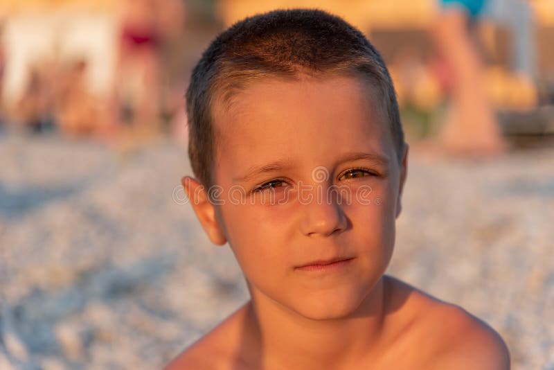 A Nice Boy on the Beach at Sunset Stock Image - Image of dusk, back ...