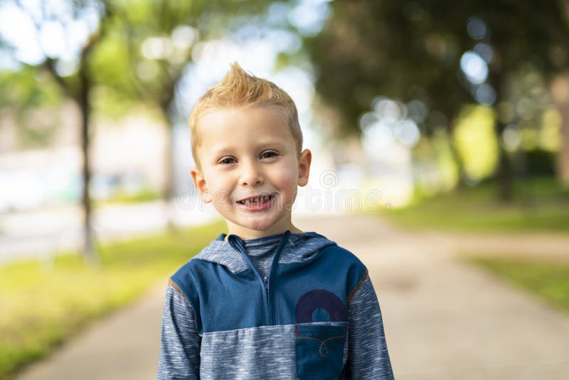A Nice Boy Outside Posing As a Model Stock Photo - Image of adorable ...