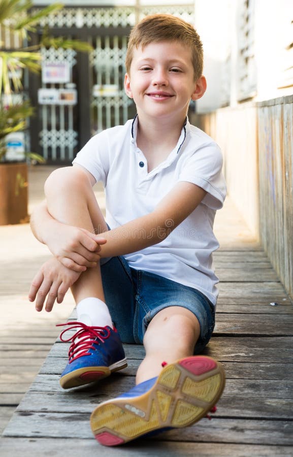 Nice boy sitting outdoor stock photo. Image of nice, green - 92698348