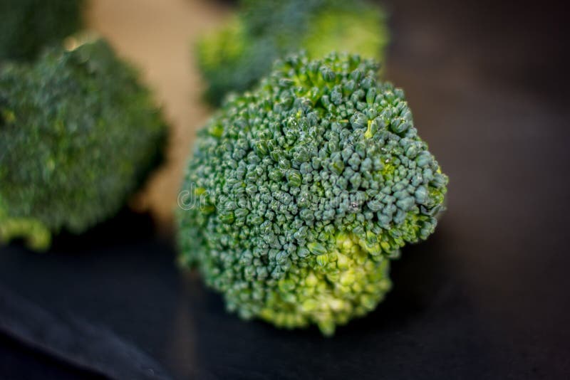 Nice Broccoli Crowns on a Black Slate Board. Stock Image - Image of ...