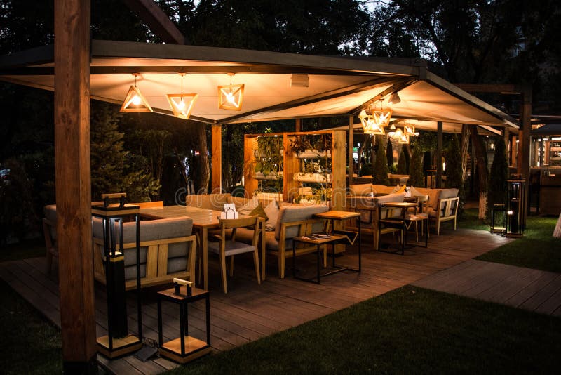 Nice cafe at night. stock photo. Image of tables, restaurant - 124037128