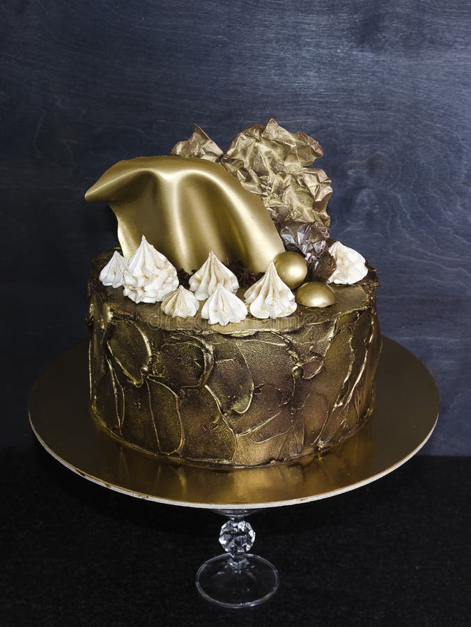 Nice Chocolate Gilded Cake with Merengues and Sails Stock Photo - Image ...