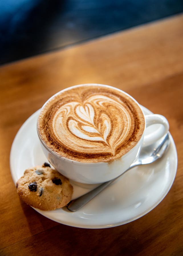 Nice Coffee Cup and Coffee Pot with Green Leaf and Sun Light Background ...