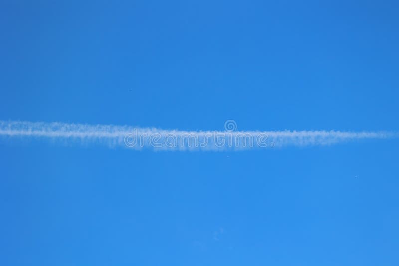 Nice Day with Blue Sky and a Cloud Made by the Engine of an Airplane ...