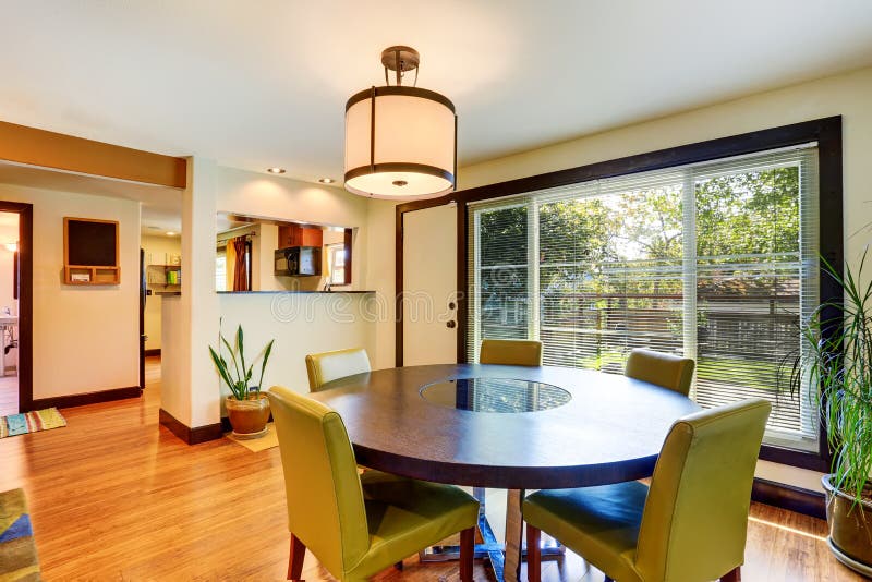 Nice Dining Area with Round Table and Green Chairs. Stock Image - Image ...
