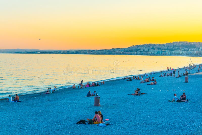 NICE, FRANCE, JUNE 11, 2017: Sunset View of People on a Beach in Nice ...