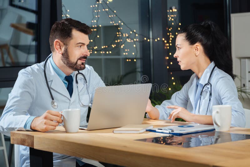 Nice Friendly Doctors Talking To Each Other Stock Image - Image of ...