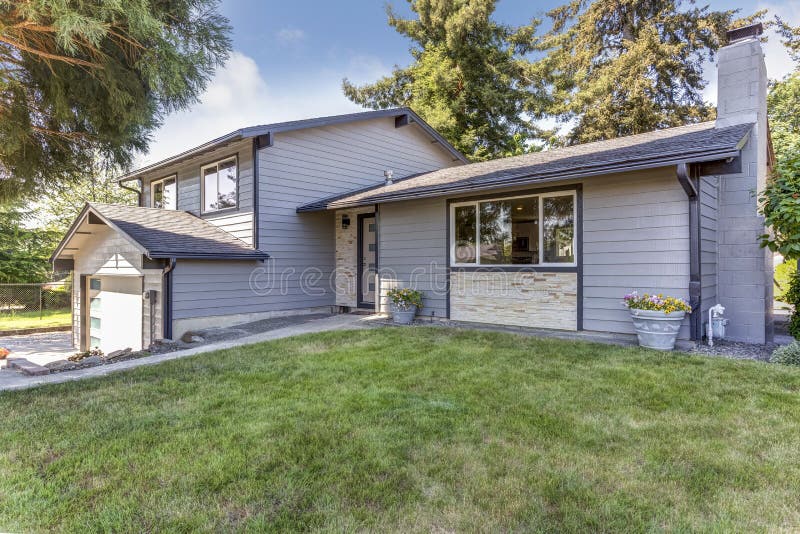 Nice Front View of Blue House Surrounded by Tall Trees. Stock Photo ...