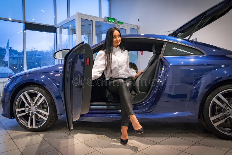 Nice girl in a car shop stock image. Image of buying - 83452751