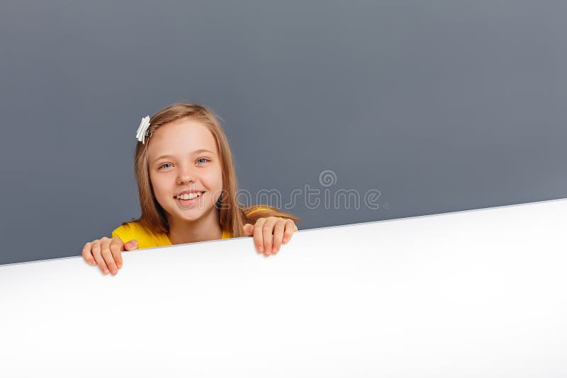 Nice Girl beside a White Blank for Text or Image Stock Photo - Image of ...