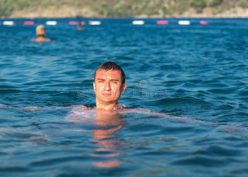 Nice Guy Bathing in the Sea Stock Photo - Image of face, blue: 137526720