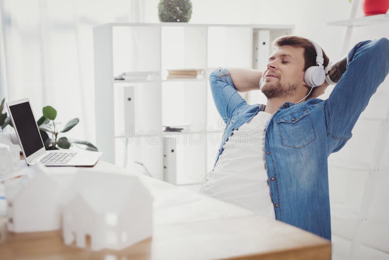 Nice handsome man resting stock image. Image of device - 136651427