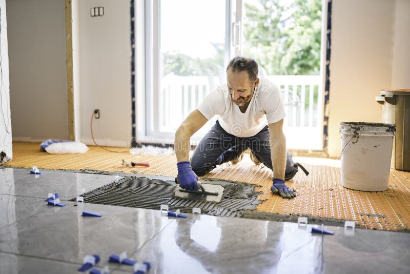 Nice Handyman Install Tile on the Floor Stock Image - Image of material ...