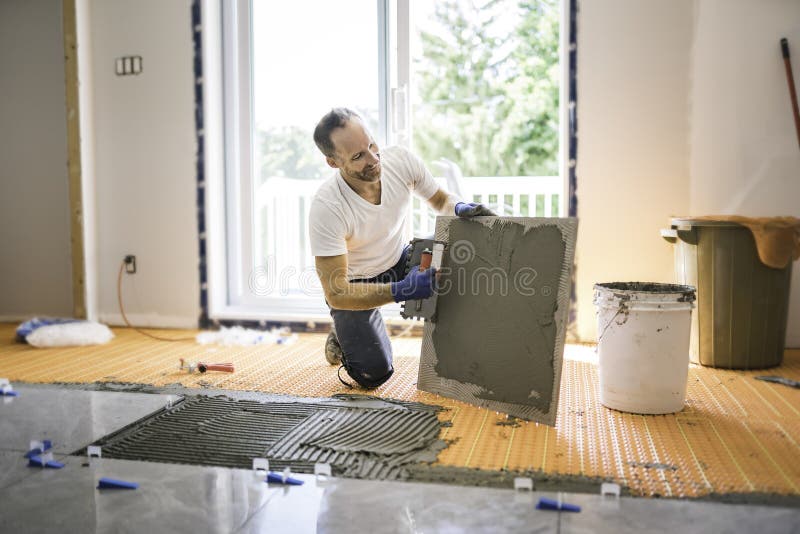 Nice Handyman Install Tile on the Floor Stock Image - Image of mortar ...