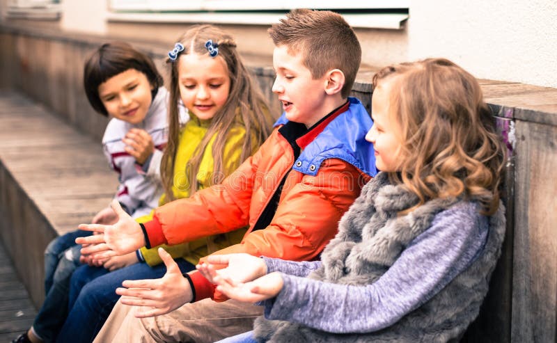 Nice Kids Talking on a Bench Stock Photo - Image of player, group ...